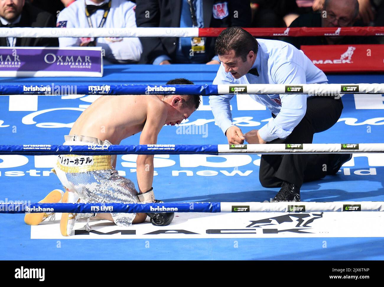Japan's Teiru Kinoshita is seen on the ground after a TKO by Philippines' Jerwin Ancajas during ...