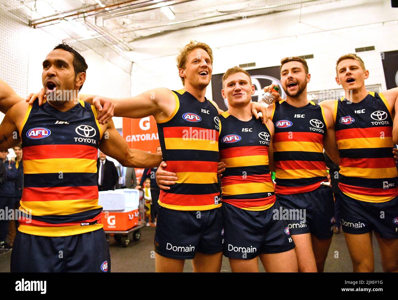 Crows players celebrate in the change room after the Round 16 AFL match ...