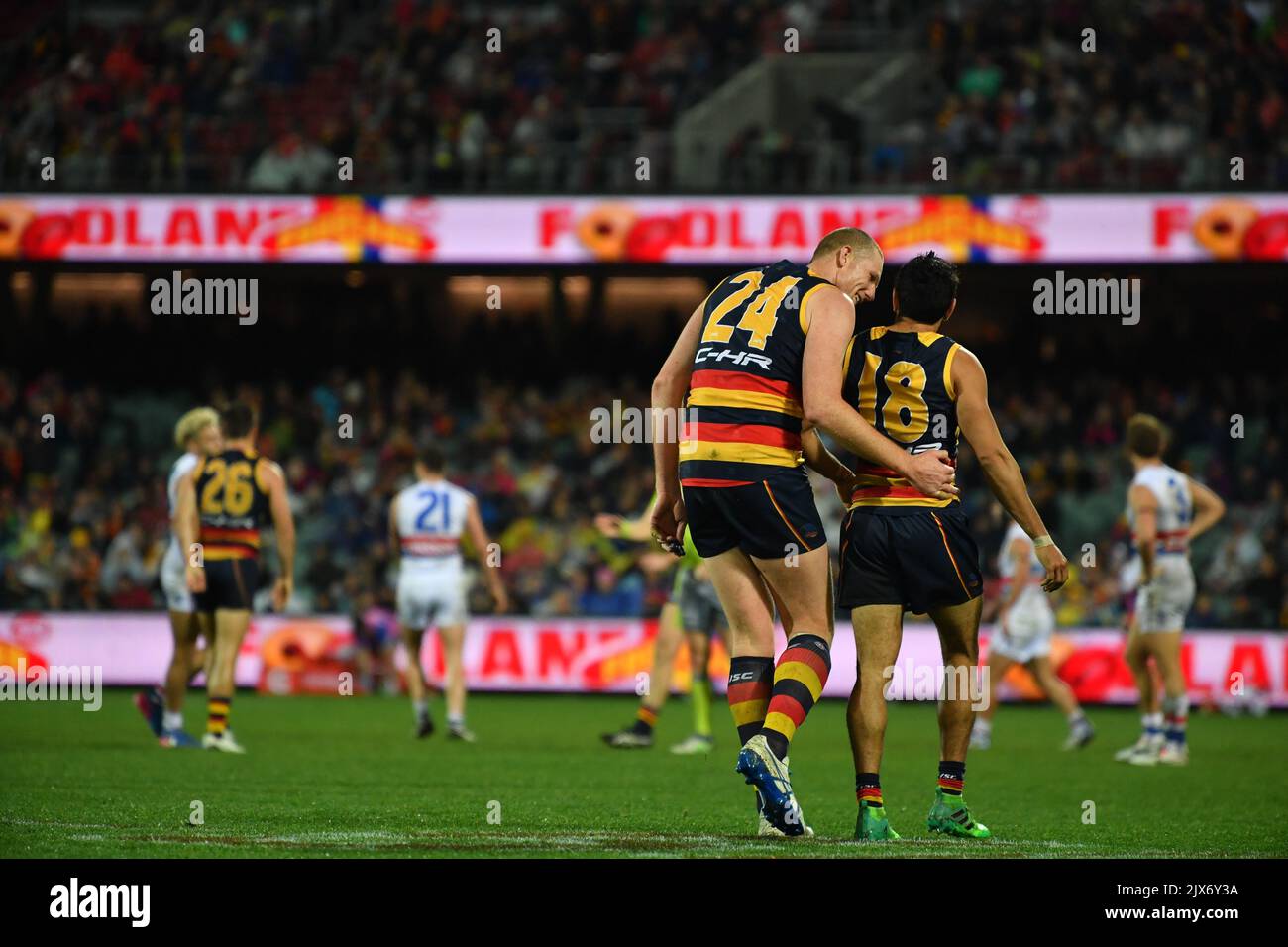Sam Jacobs (second right) and Eddie Betts of the Crows celebrate a goal ...