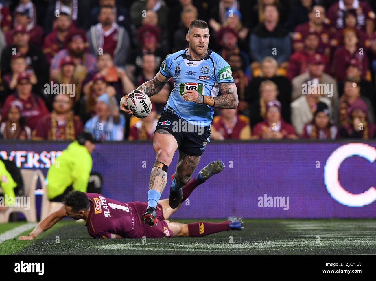 Josh Dugan of the NSW Blues gets past Maroons player Billy Slater to ...