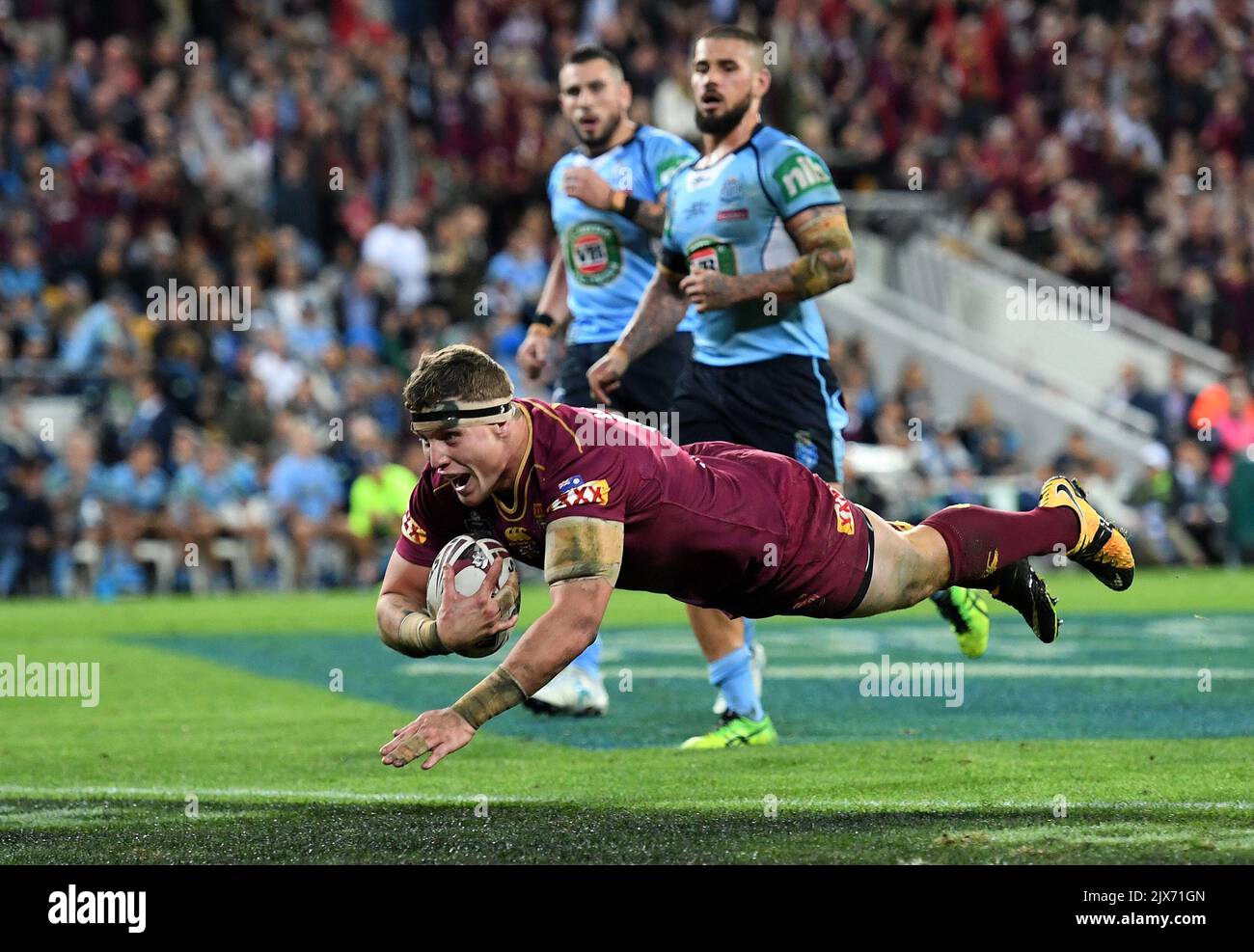 Jarred Wallace of the Queensland Maroons scores a try during State of ...