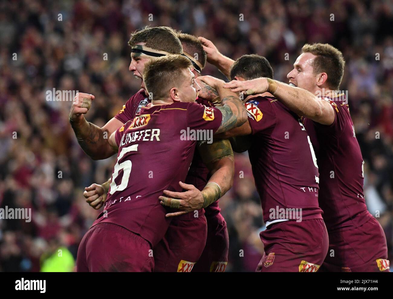 Queensland Maroons players celebrate a try during State of Origin Game ...