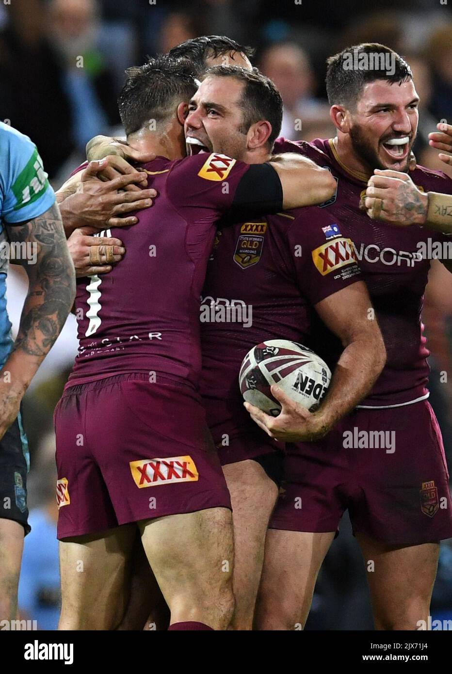 Captain of the Queensland Maroons Cameron Smith (centre) and teammates ...