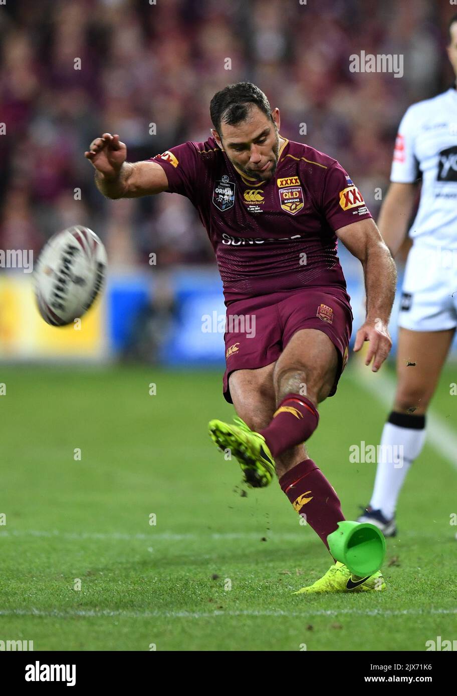 Captain of the Queensland Maroons Cameron Smith kicks during game 3 of ...