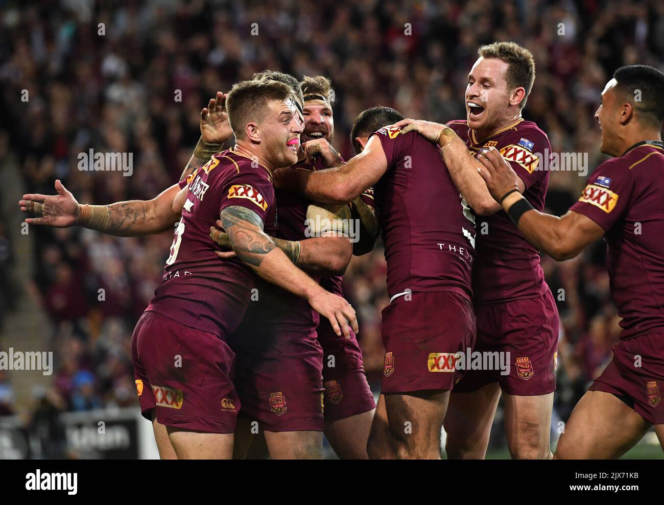 Queensland Maroons players celebrate a try during State of Origin Game ...