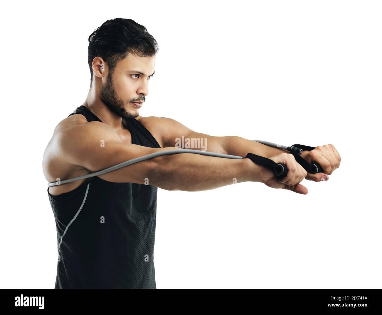 Extend yourself. Studio shot of a young man working out with a ...