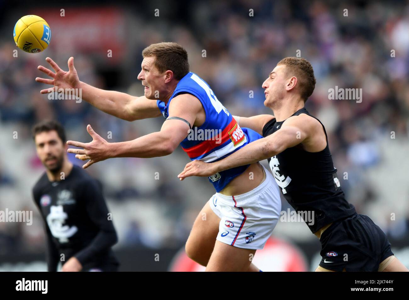 Jack Redpath of the Bulldogs takes a mark ahead of Liam Jones of the ...
