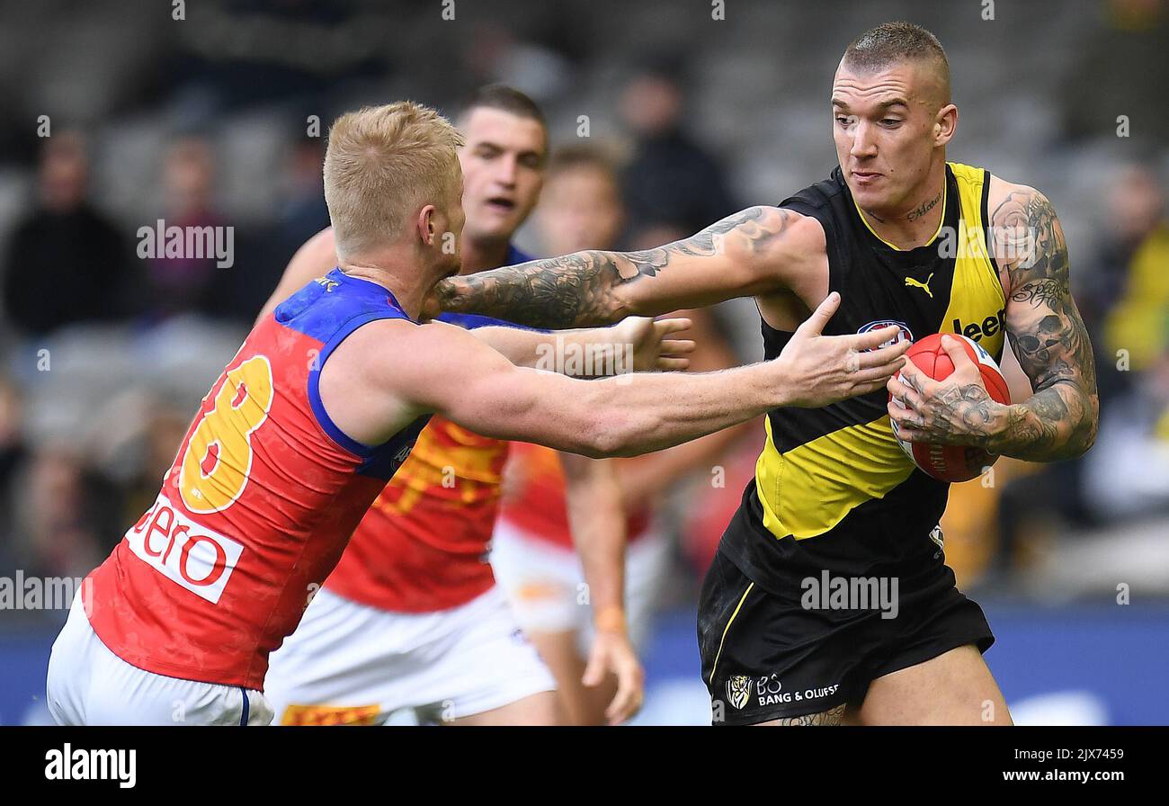 Dustin Martin of the Tigers (right) and Nick Robertson of the Lions ...