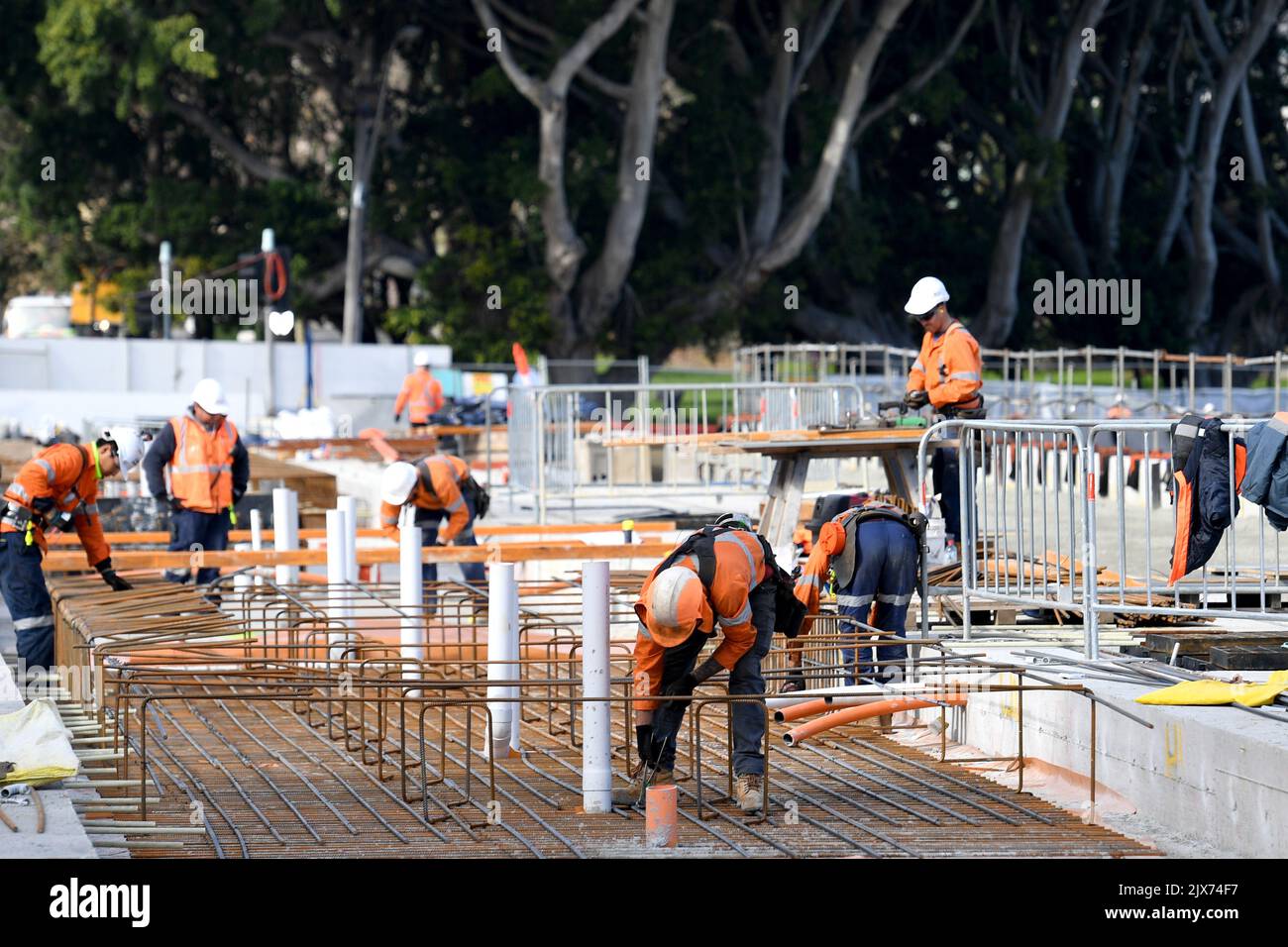 Construction workers continue work on the Sydney Light Rail project ...