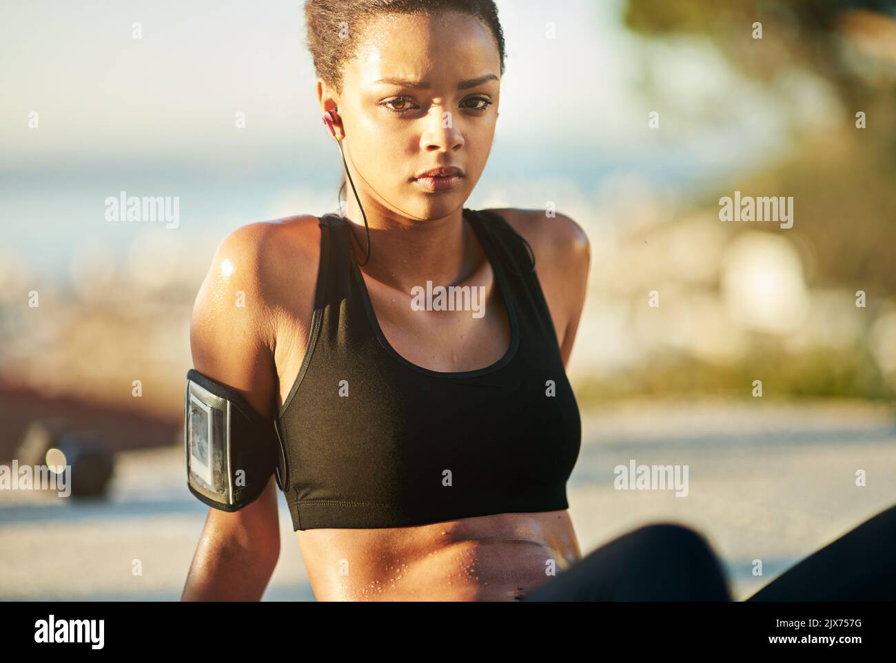 The body achieves what the mind believes. a young woman exercising ...