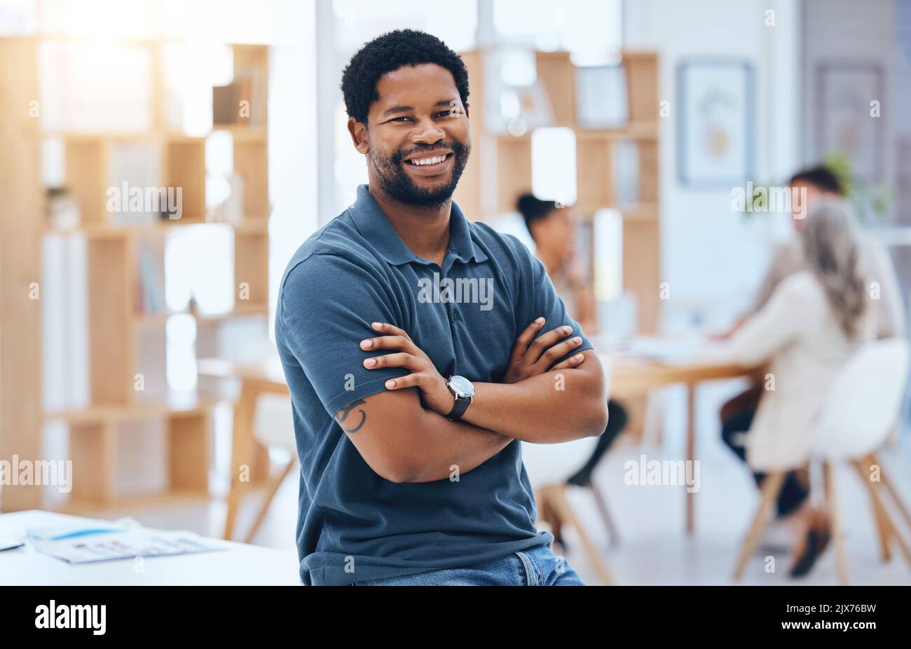 Business meeting, black man and smile portrait with arms crossed at coworking conference desk ...