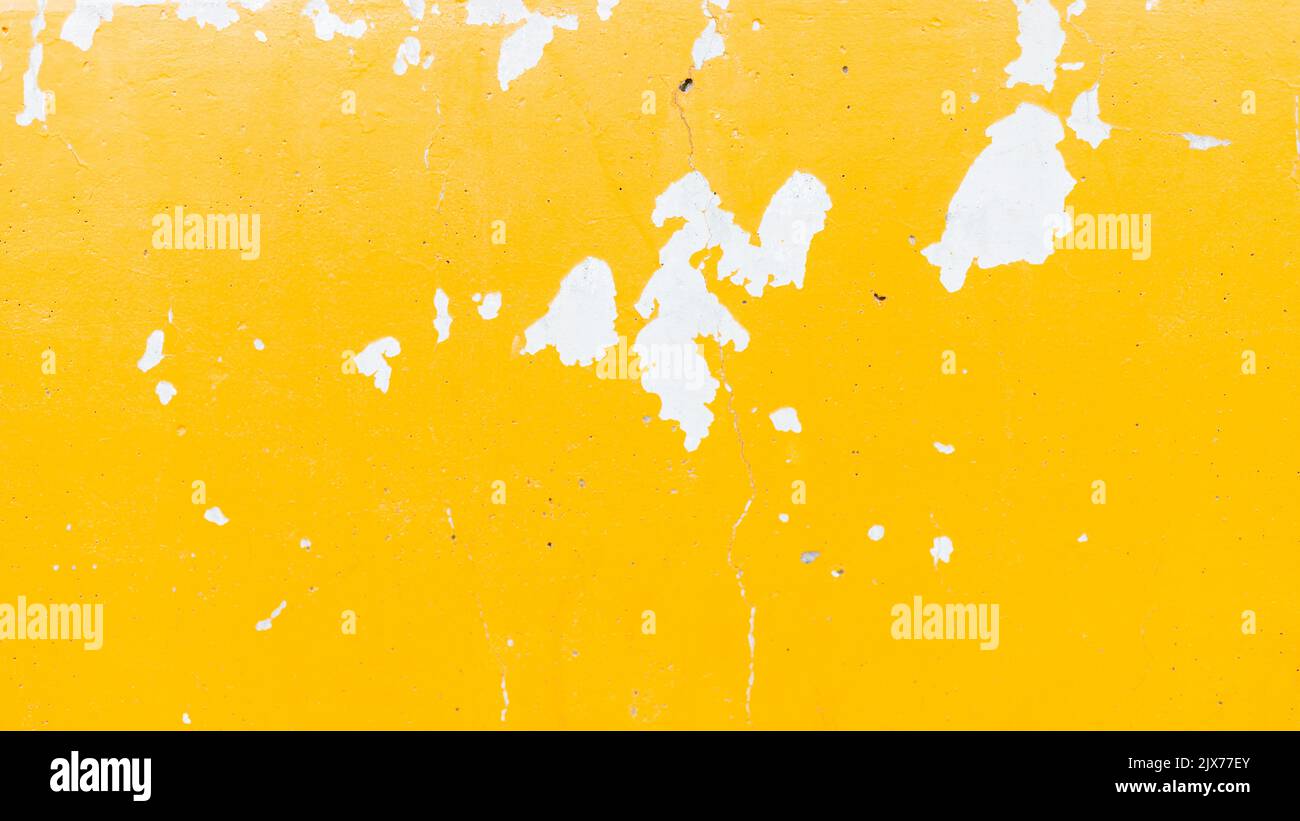Wall yellow painted peel out texture background Stock Photo - Alamy