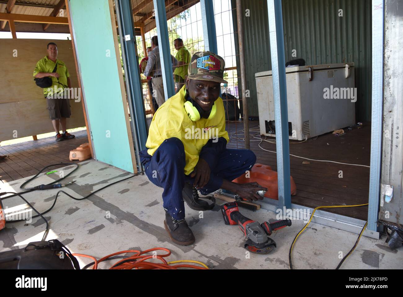 Workers begin construction on a home in the indigenous community of ...