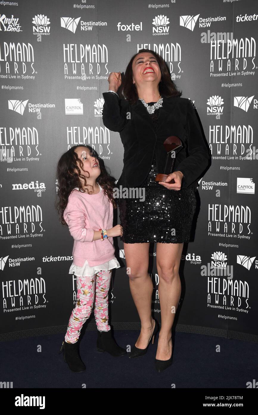 Leticia Caceres (right) poses for a photograph with the award for Best ...