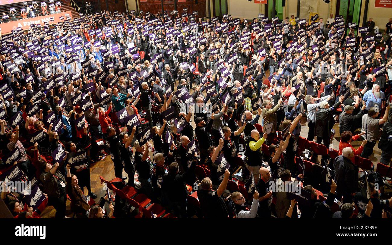 Delegates and Labor members rise for a photo opportunity for the motion ...