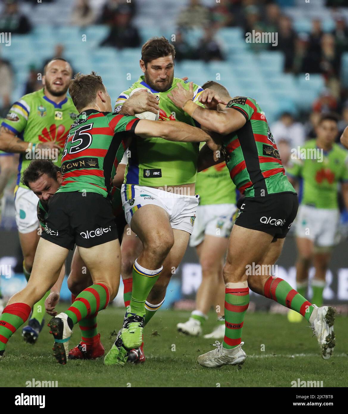 David Taylor of the Raiders is tackled during the Round 21 NRL match ...