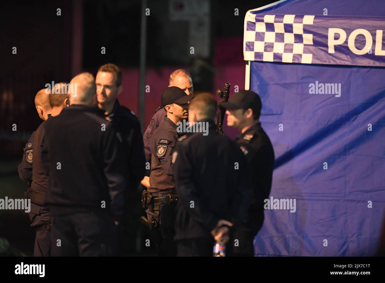 Australian Federal Police and NSW Police officers are seen during ...