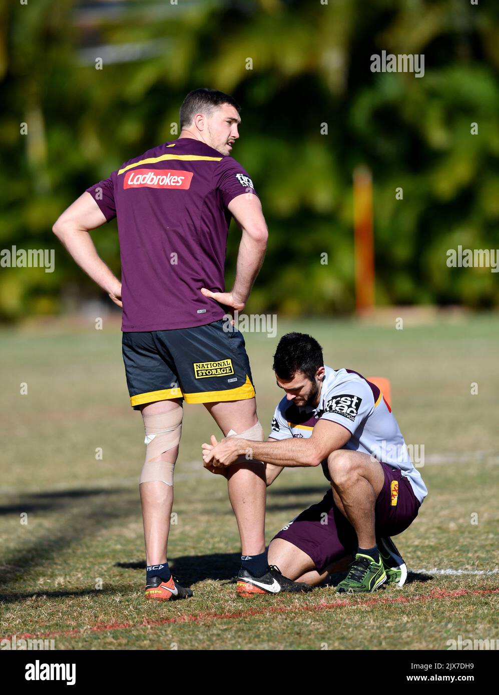 Brisbane Broncos player Corey Oates has his knee strapped during a ...