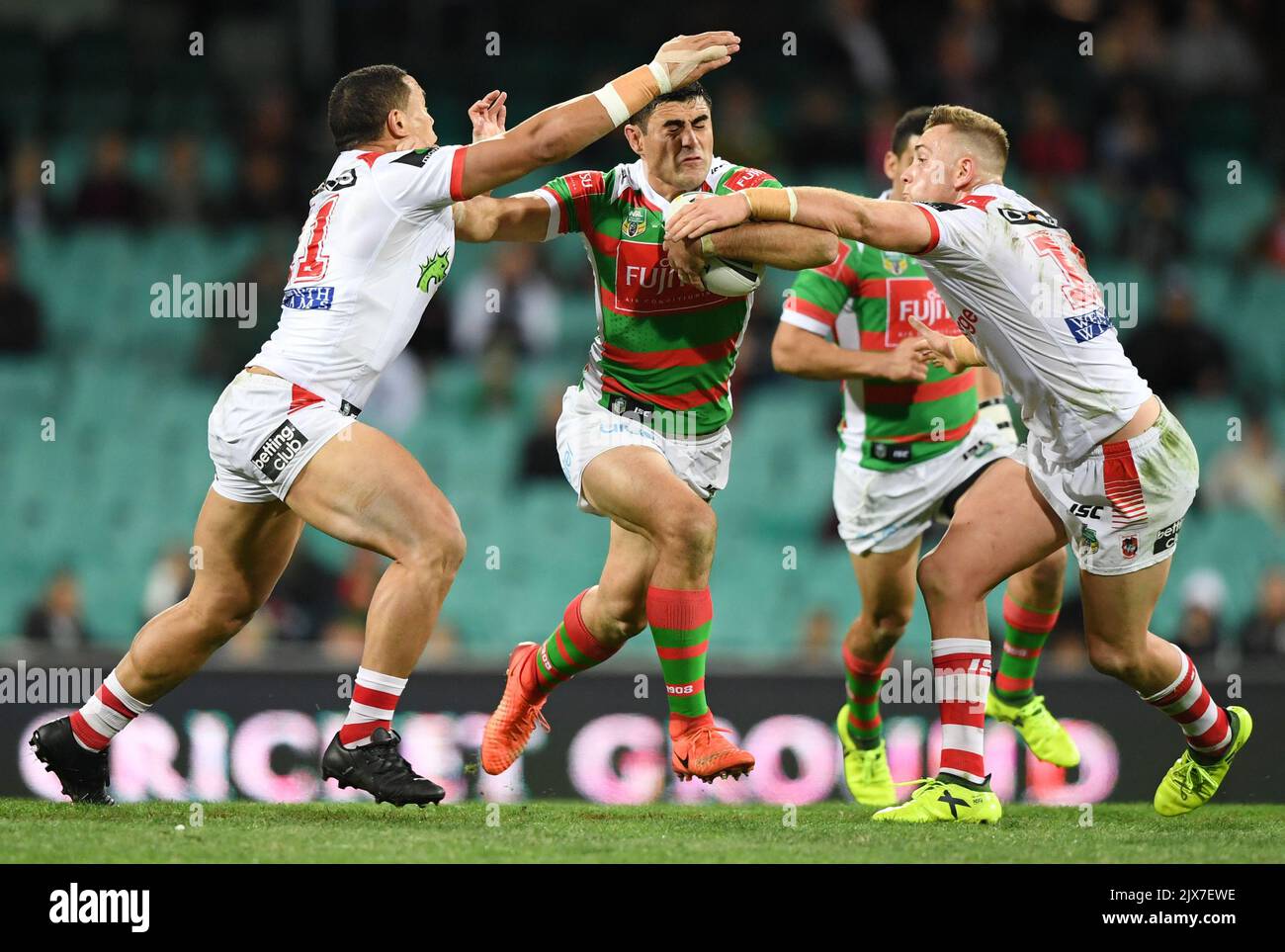 Bryson Goodwin of the Rabbitohs is tackled as he runs with the ball ...