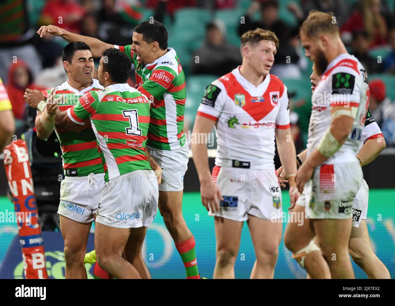 Bryson Goodwin of the Rabbitohs (left) celebrates scoring a try with ...