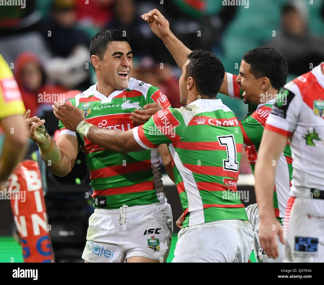 Bryson Goodwin of the Rabbitohs (left) celebrates scoring a try with ...