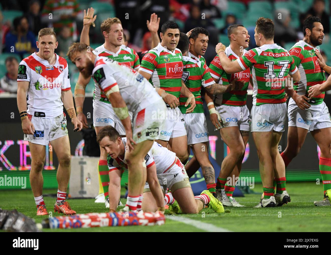 Bryson Goodwin of the Rabbitohs (centre) celebrates with his team mates ...