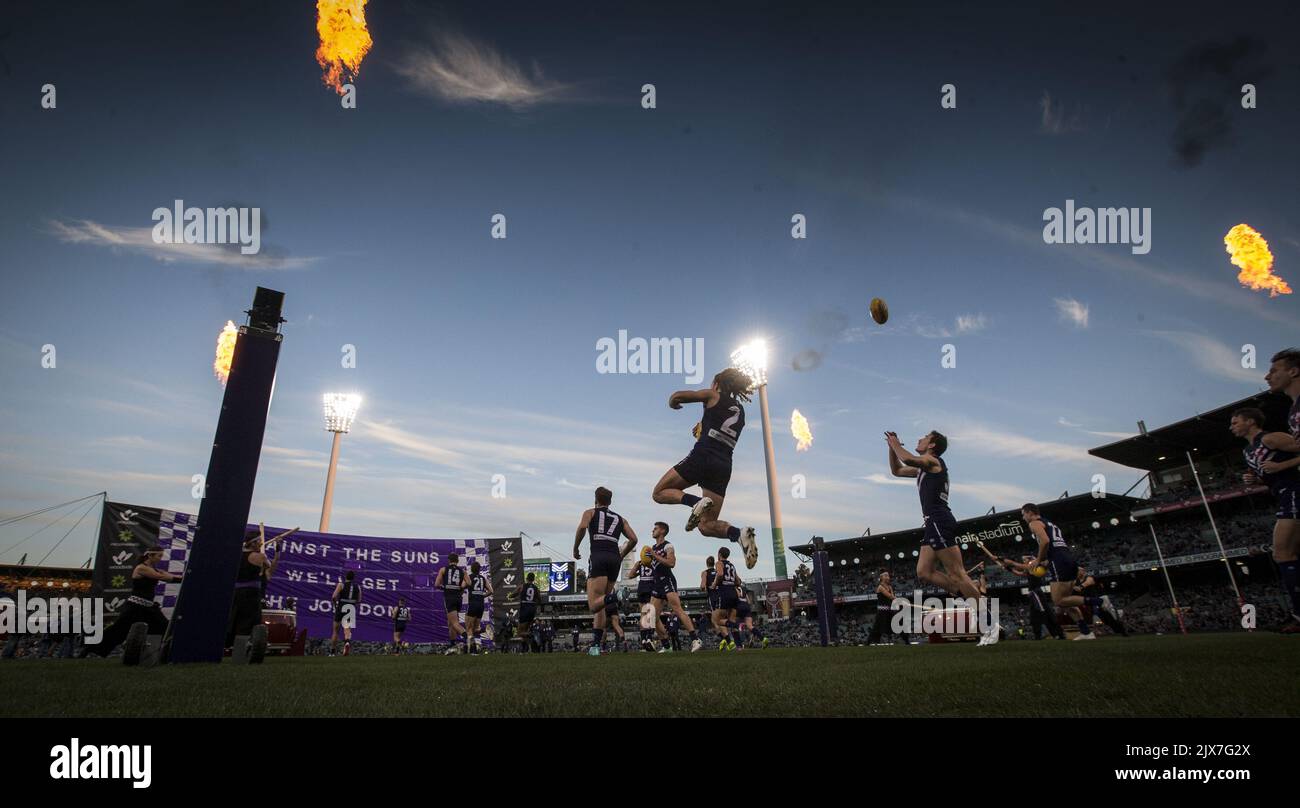 Fremantle enter the arena before the round 20 AFL match between the ...