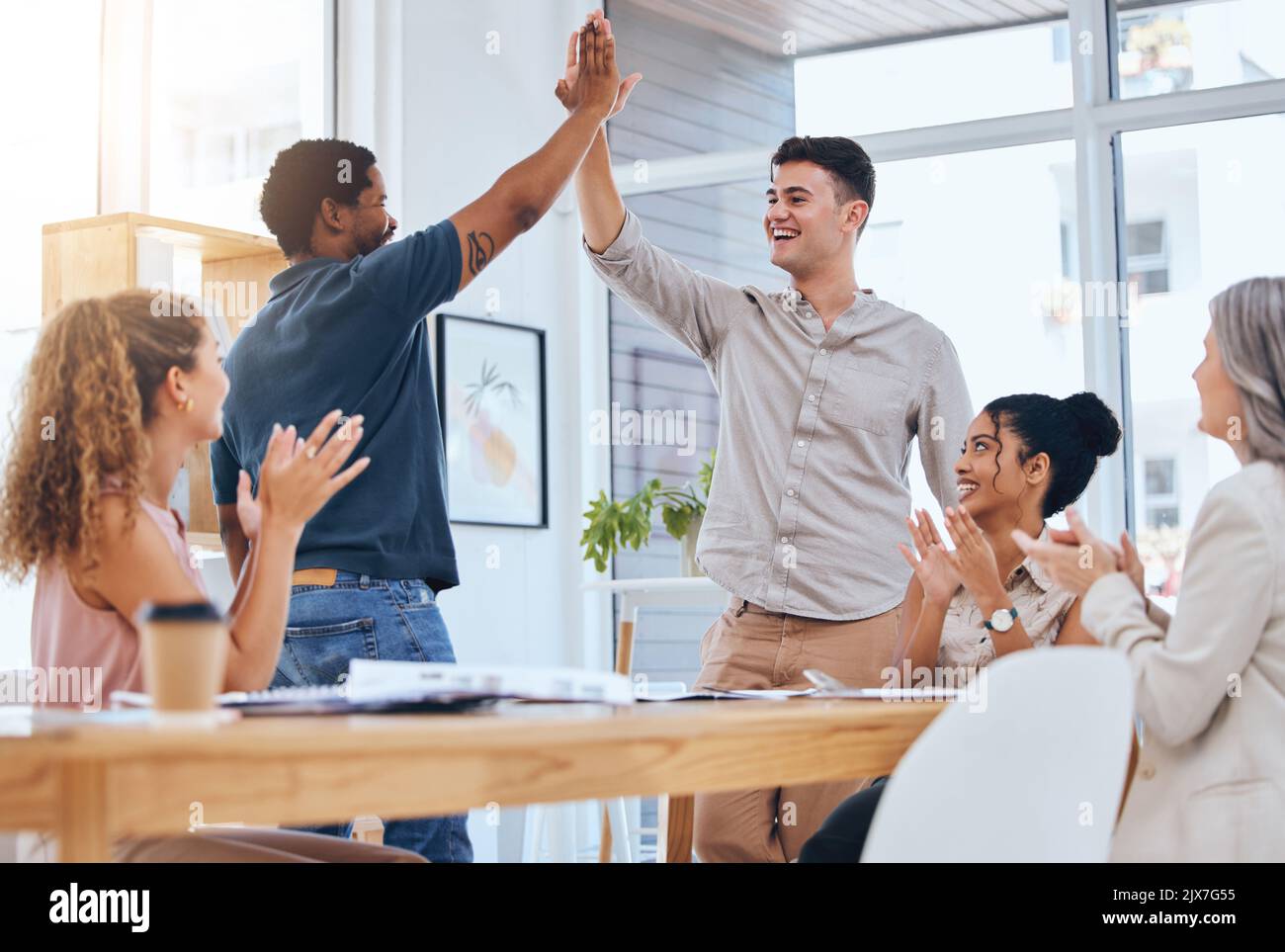 Business people giving high five for success in meeting, people clapping hands for team ...