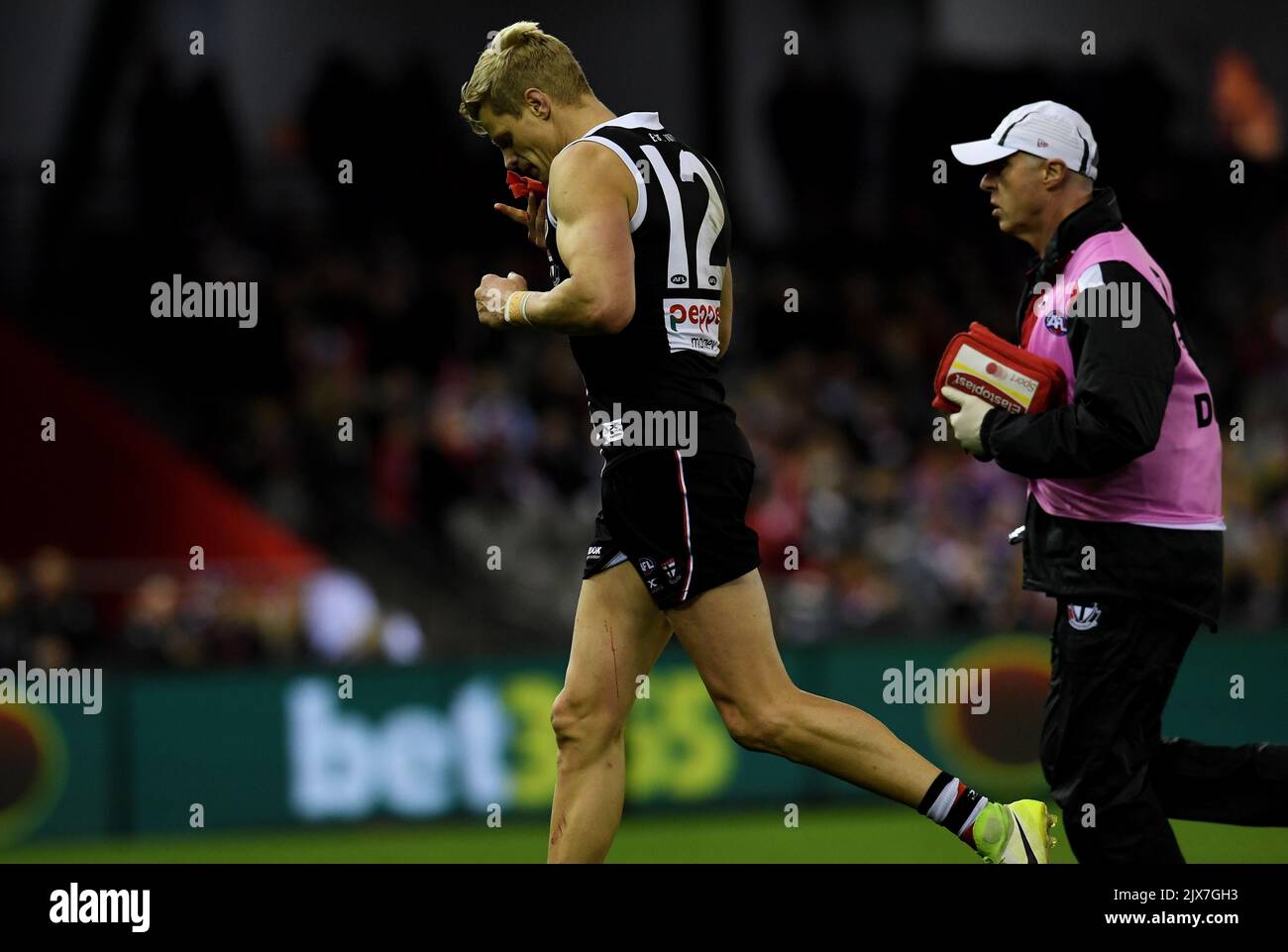 Nick Riewoldt of the Saints comes off with the blood rule after being ...