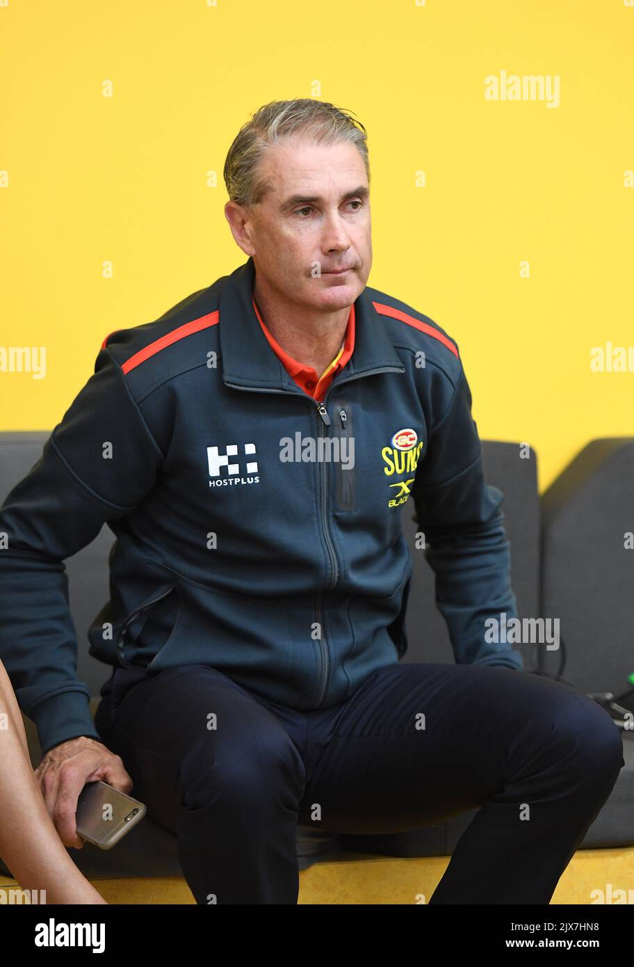 New interim coach Dean Solomon looks on from the back of a press ...