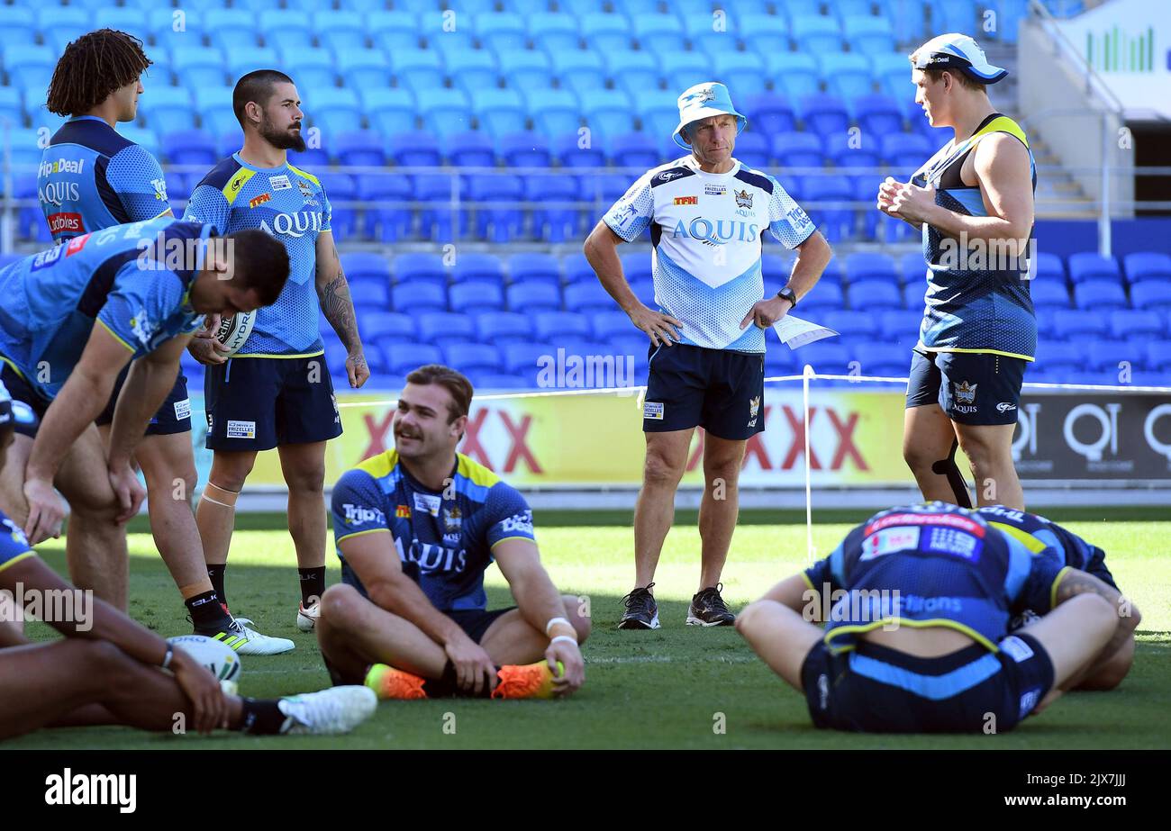 Coach Neil Henry (centre) is seen with players during the Gold Coast ...