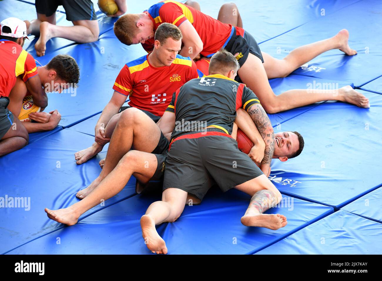 Gold Coast Suns players are seen during a wrestling drill following ...