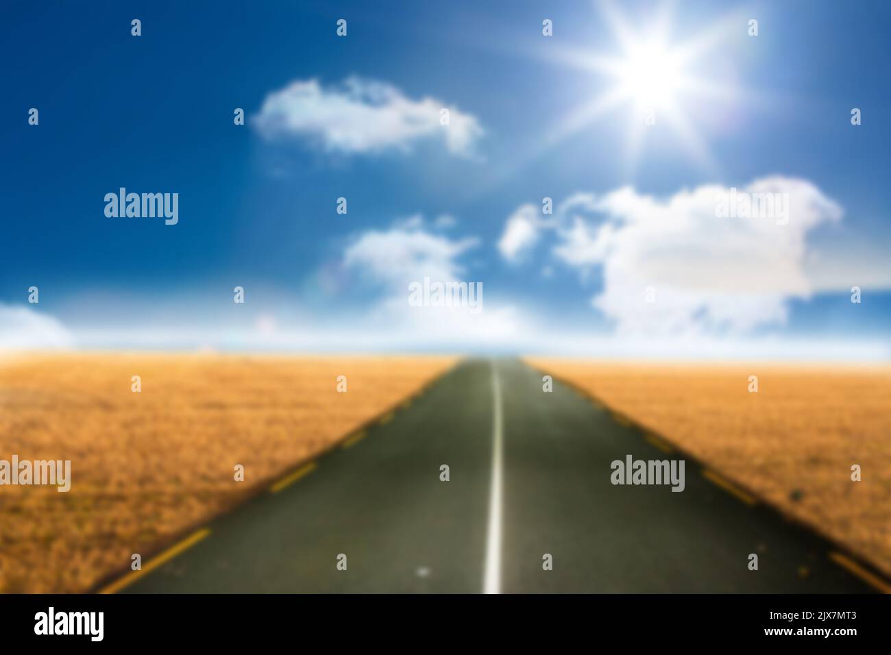 Country road through field against bright sky Stock Photo - Alamy
