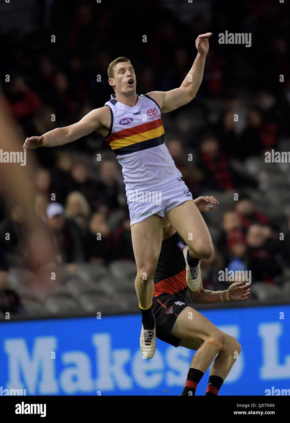 Josh Jenkins of the Crows is pushed by Michael Hurley of the Bombers ...