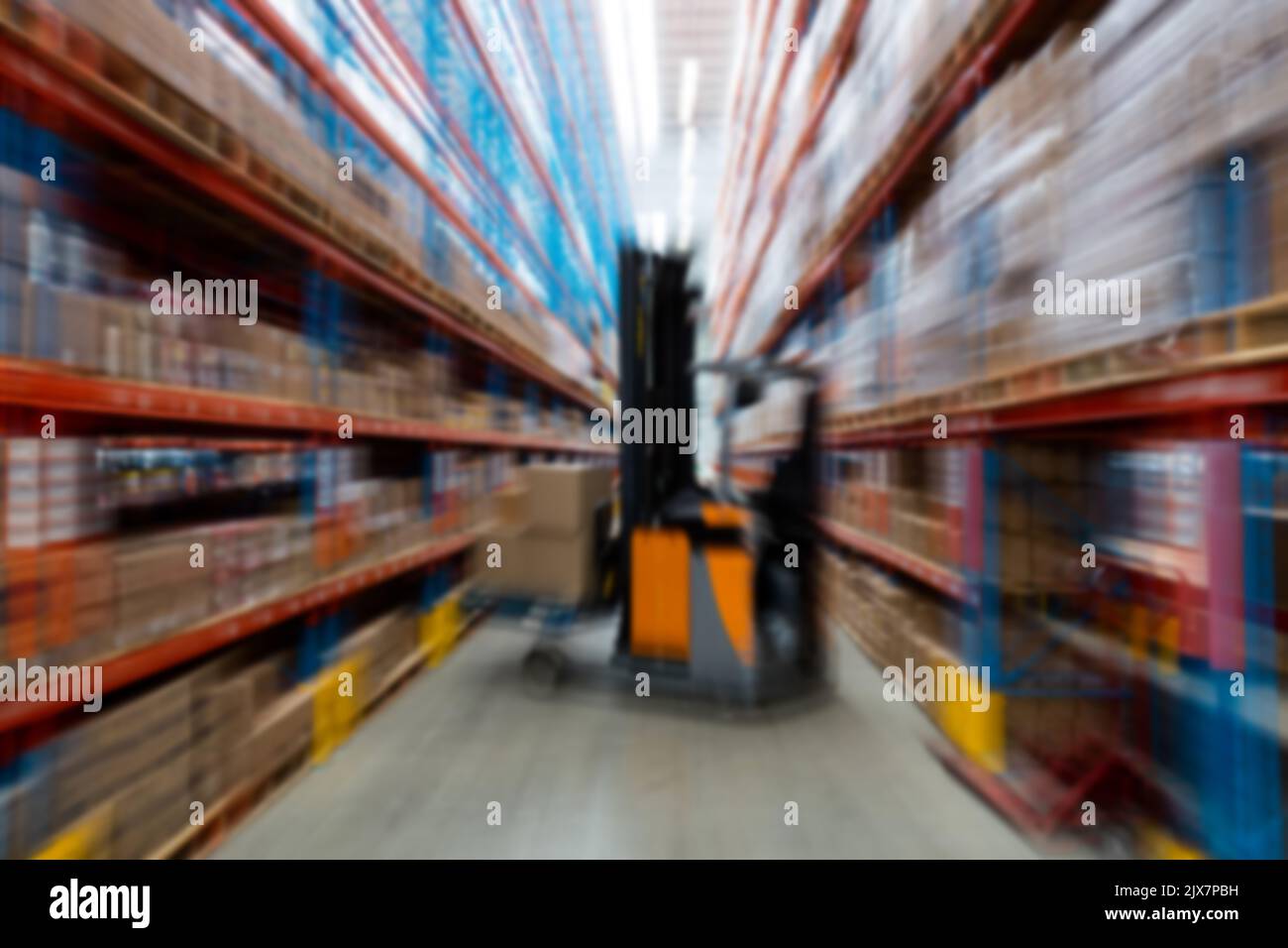 Fork lift by rack of boxes Stock Photo - Alamy