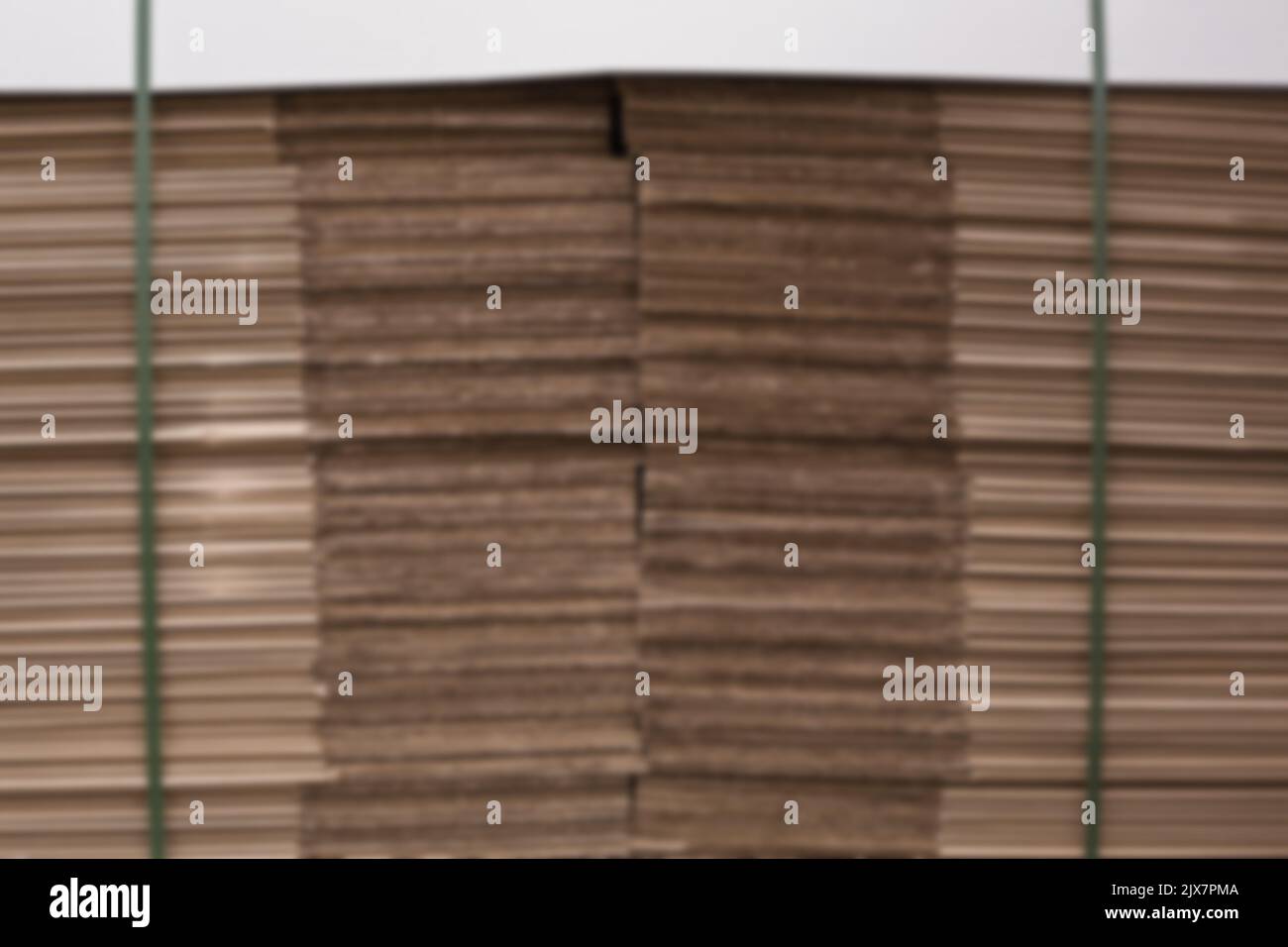 Stacked planks in distribution warehouse Stock Photo - Alamy