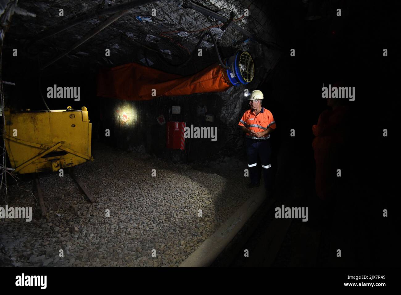 A guide explains the workings of a mine during a tour of the Hard Times ...