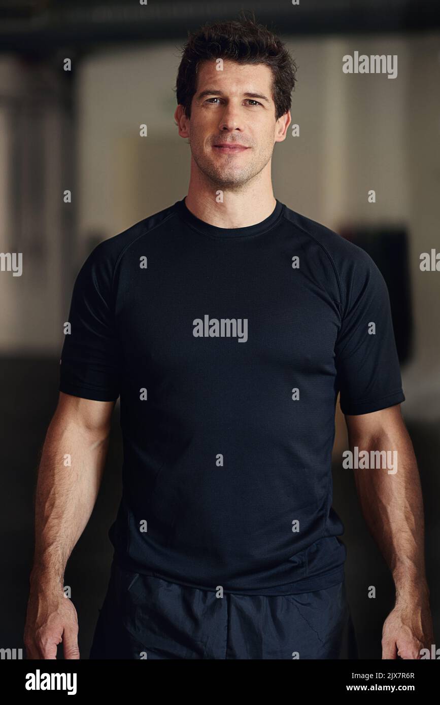 The best part of my day is spent at gym. Portrait of a fit man standing ...