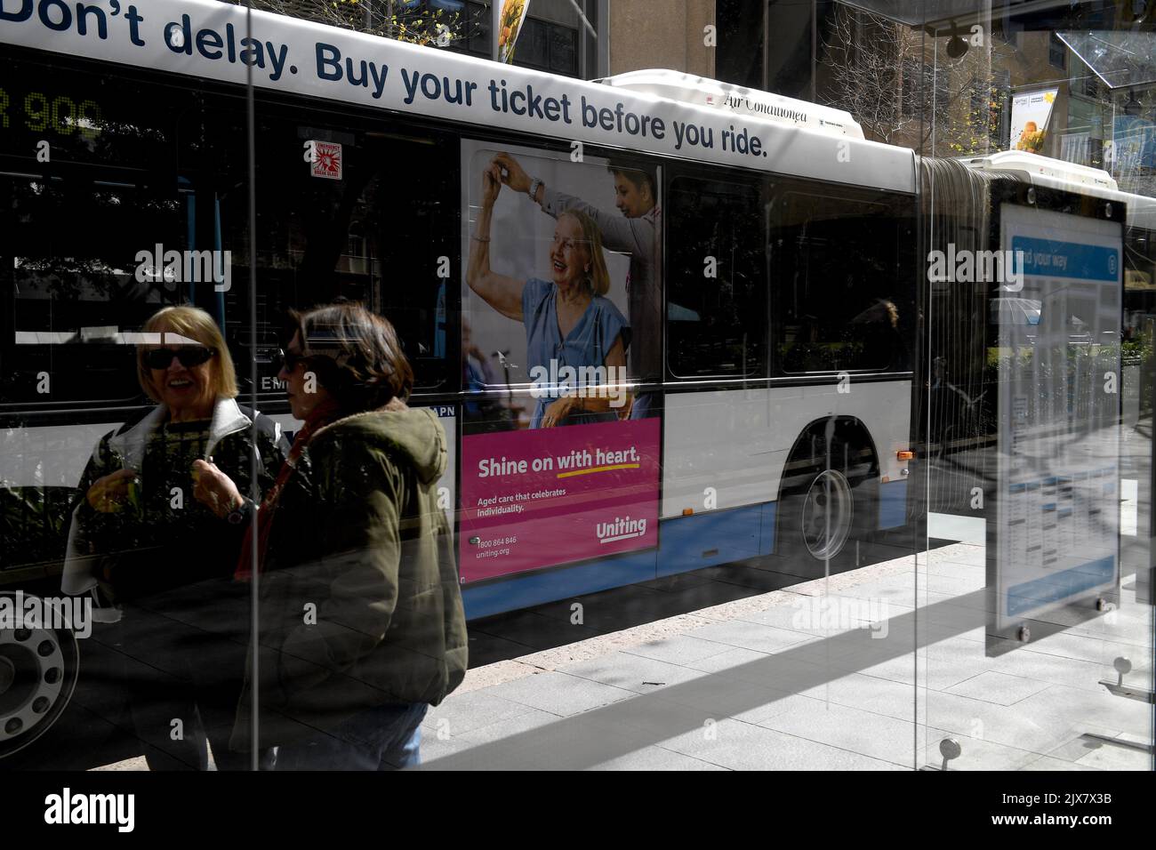 Commuters on a bus stop in Sydney, Saturday, August 19, 2017. (AAP ...