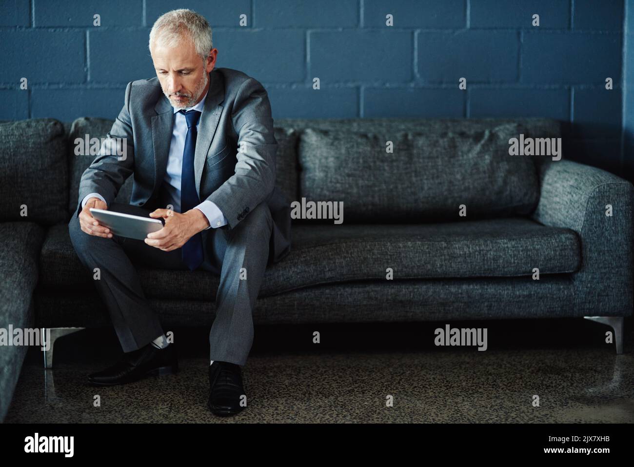 Using online tools to boost business. a businessman using a digital ...
