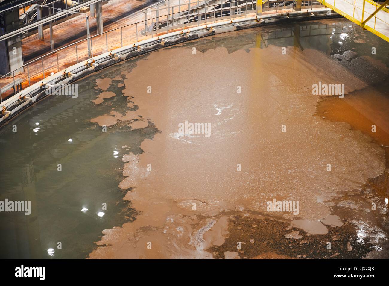 Brown liquid material in contemporary gravity thickener Stock Photo - Alamy