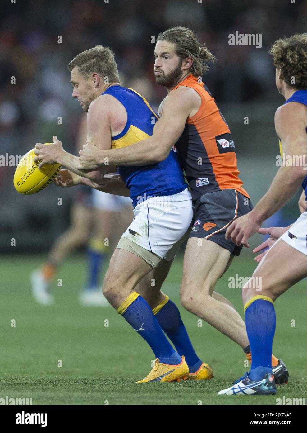 Callan Ward of the Giants tackles Sam Mitchell of the Eagles during the ...