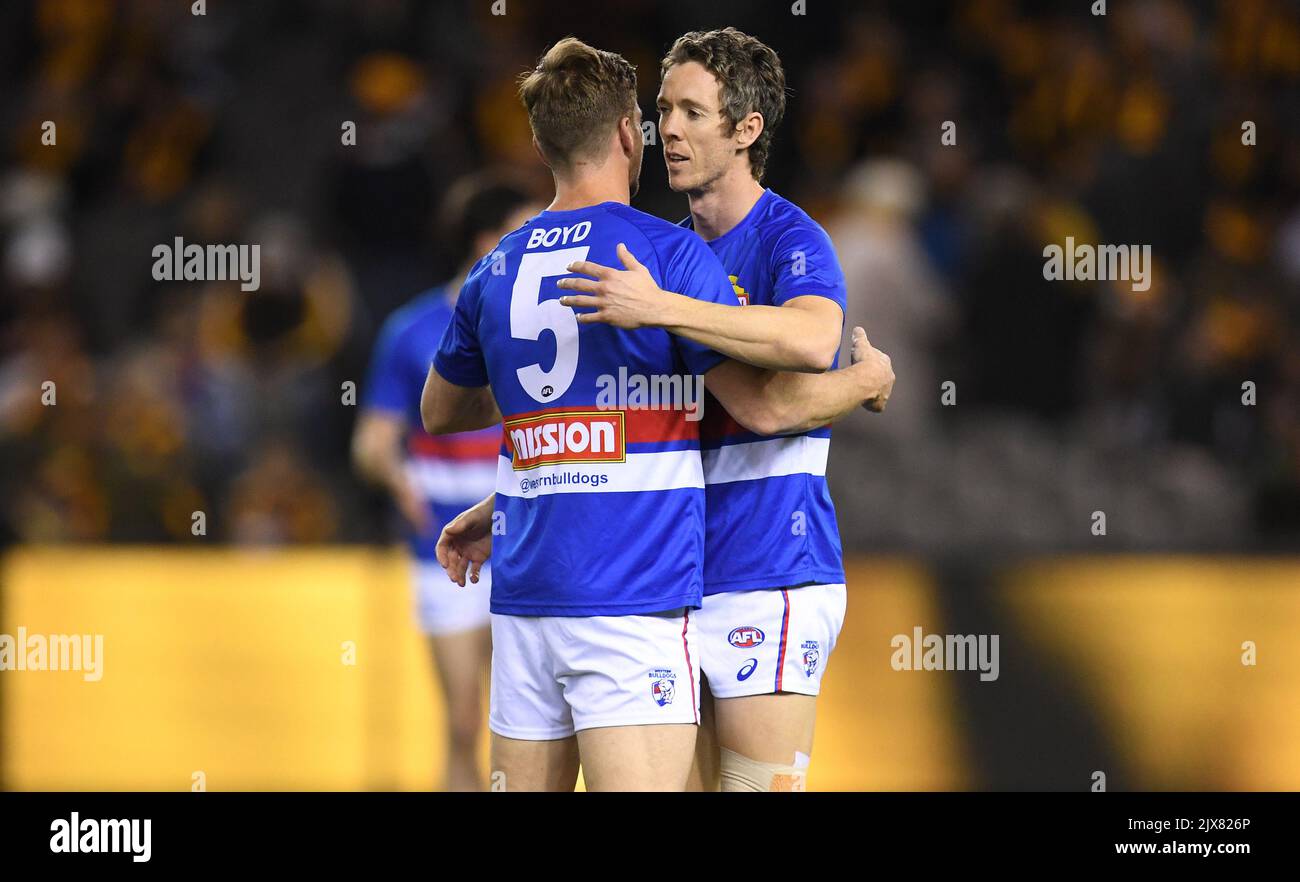 Matthew Boyd (Left) and Robert Murphy of the Bulldogs embrace before ...