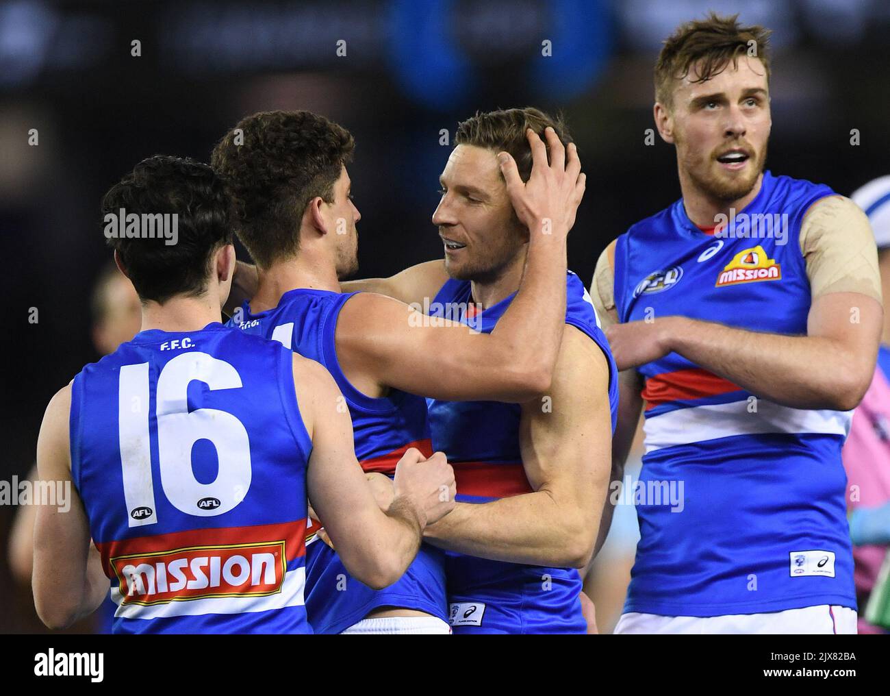 Matthew Boyd of the Bulldogs (third from left) is seen after kicking a ...