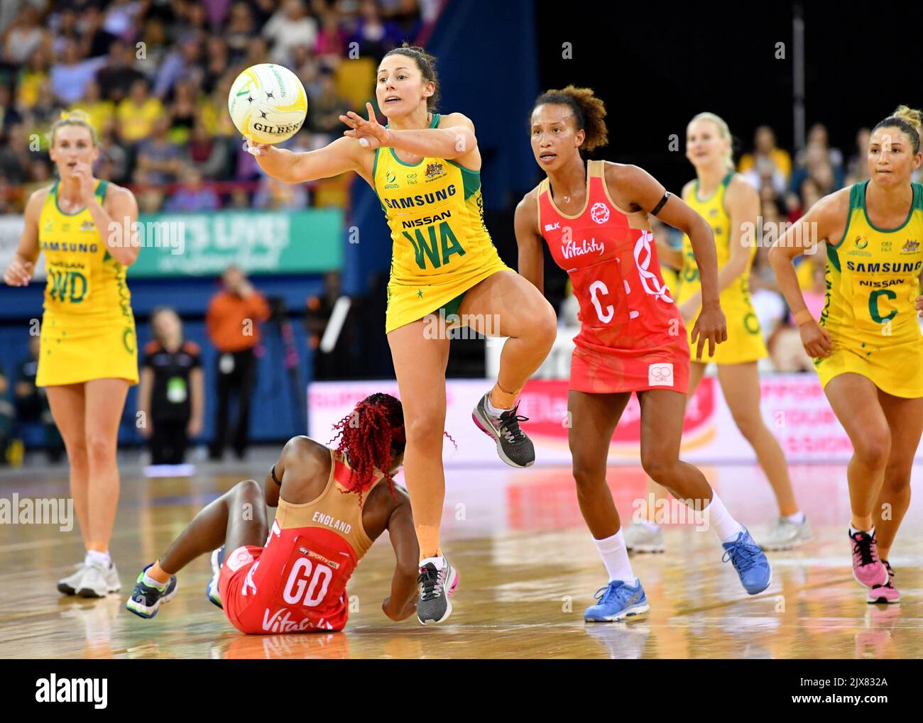 Madison Robinson (centre) of Australia gets past Ama Agbeze of England ...