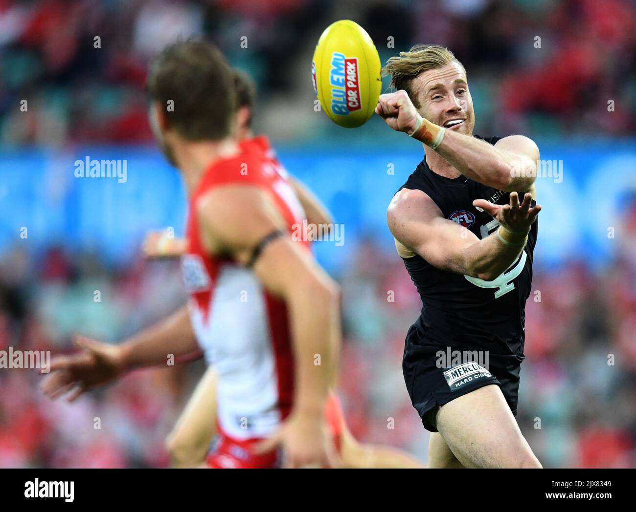 Nick Graham of the Blues gets his pass away during the AFL Round 23 ...