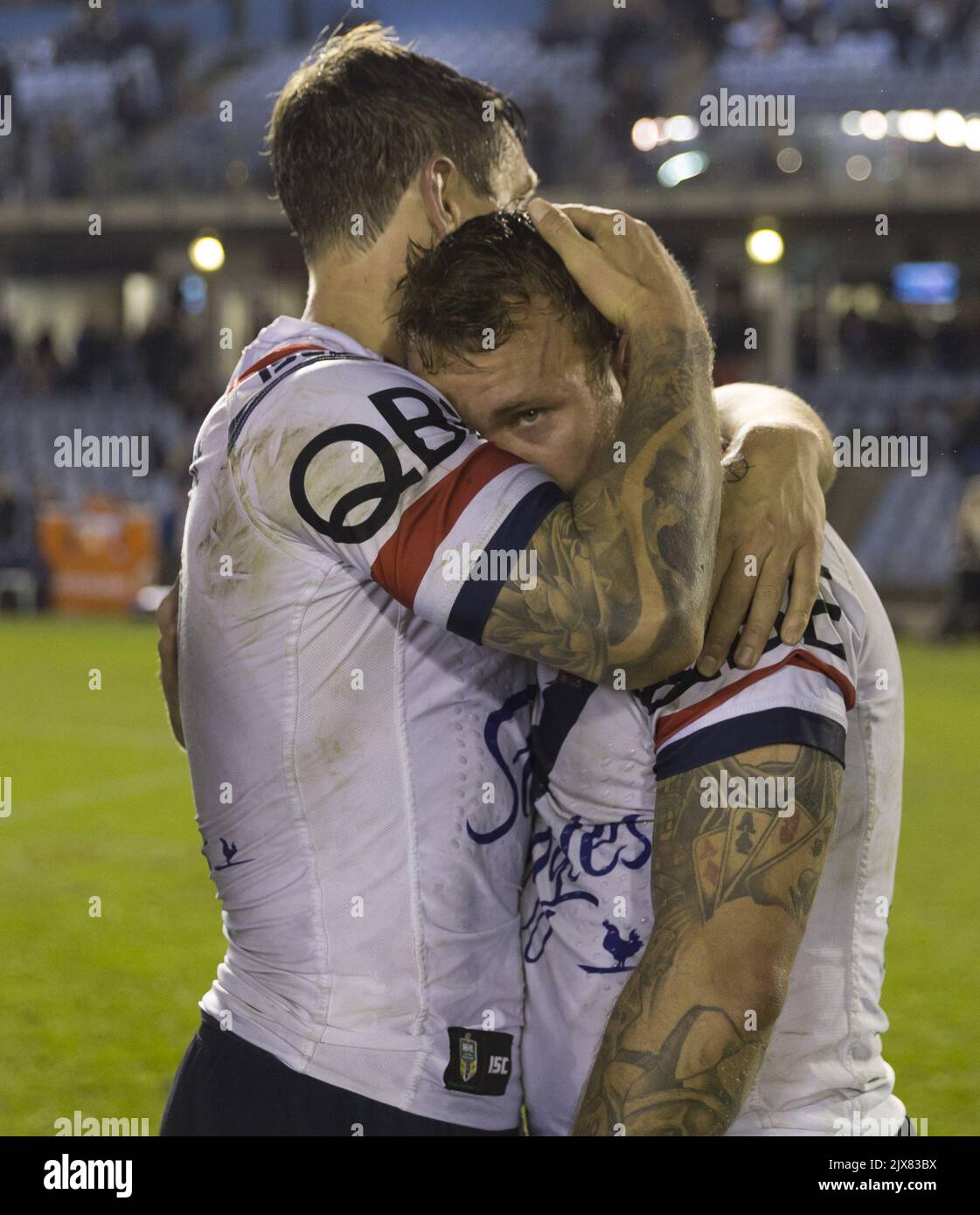 Mitchell Pearce of the Roosters hugs Jake Friend of the Roosters after ...