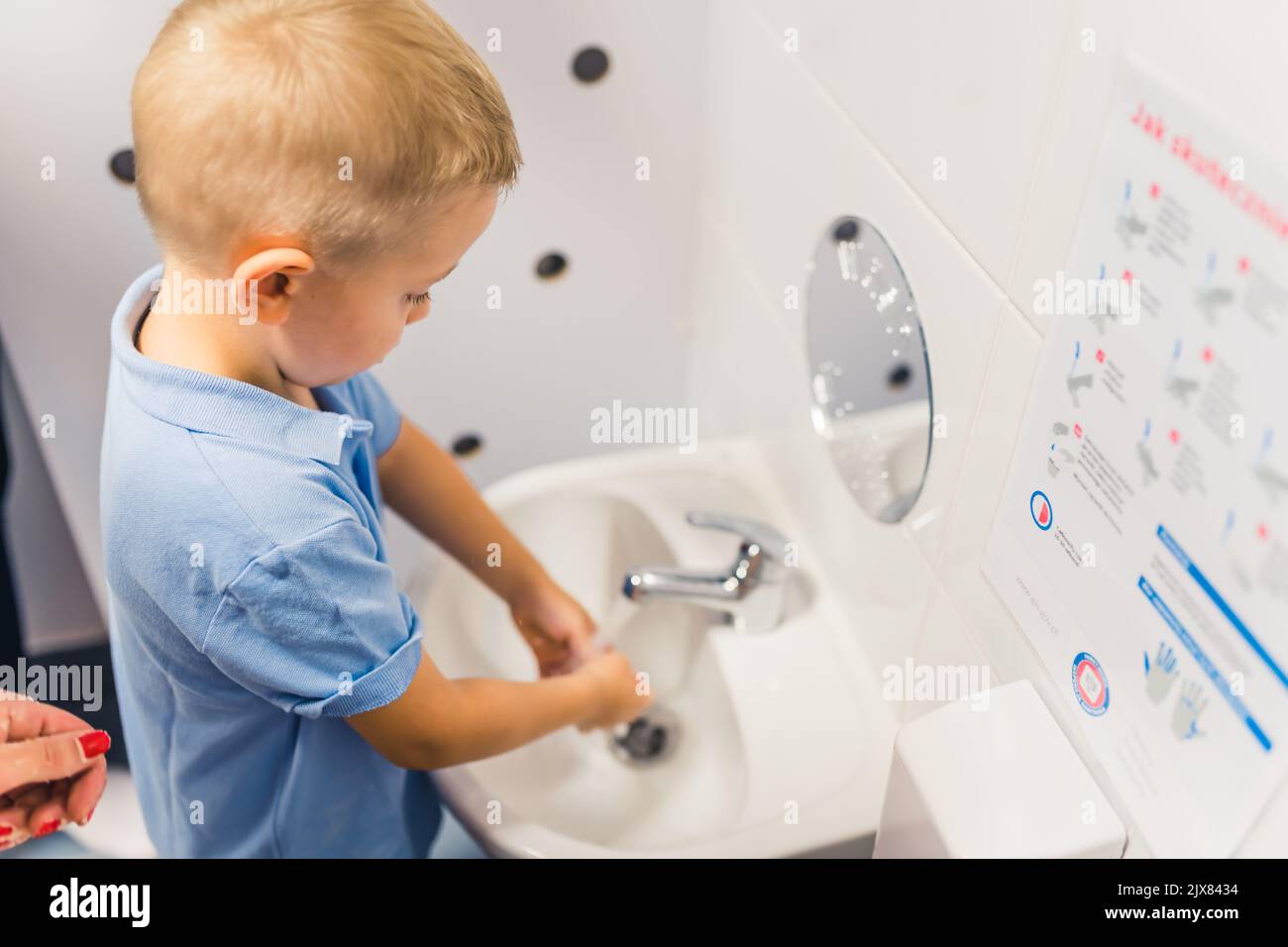 Toddler boy washing his hands with soap. Concept of early healthy ...