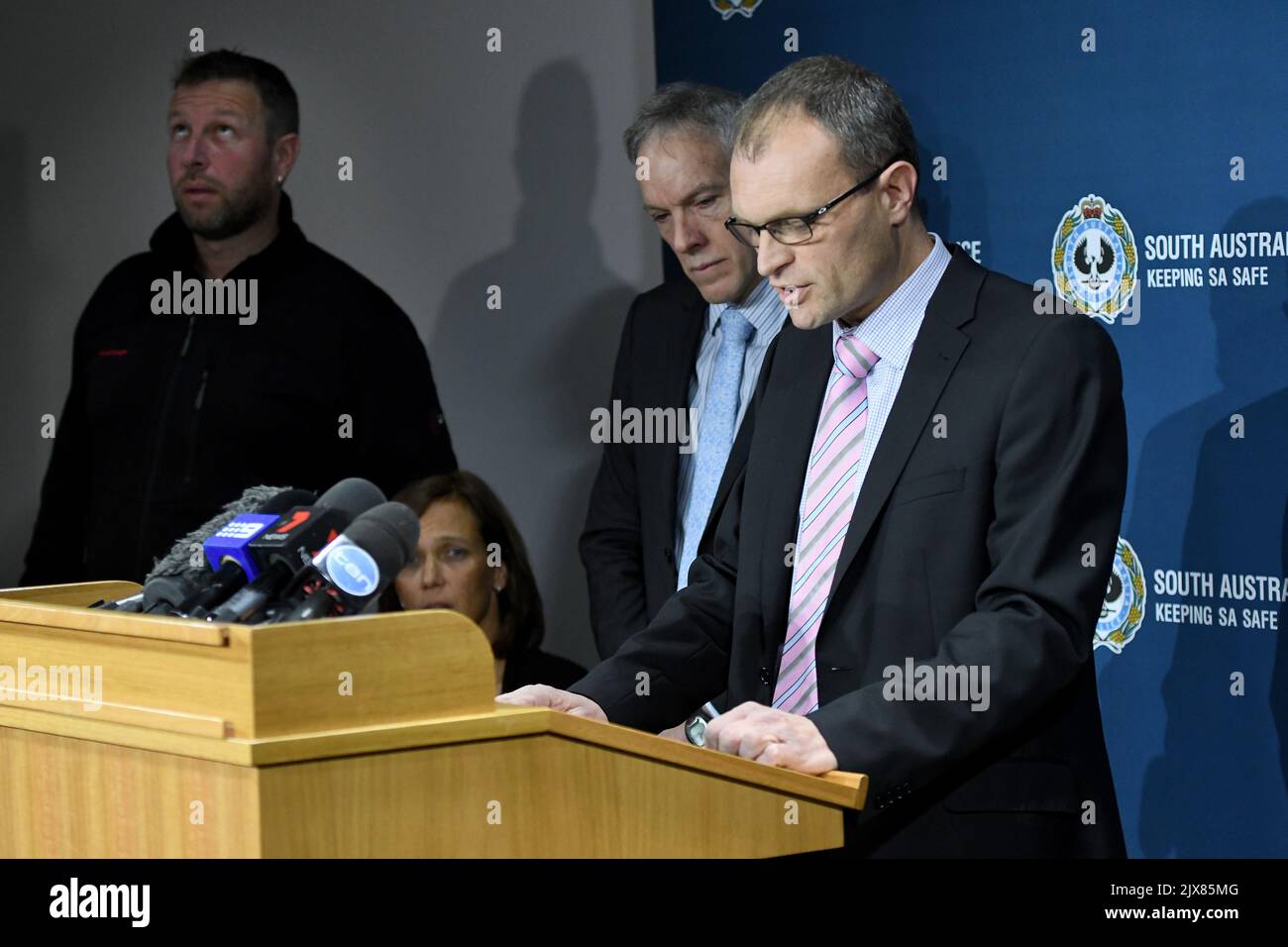 South Australian Detective Brevet Sergeant Anthony van der Steldt reads a statement from the ...