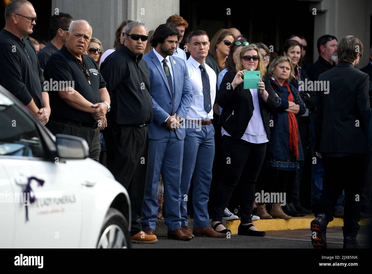 Newcastle Knights NRL players David Bhana and Danny Levi (centre) are seen at the memorial ...